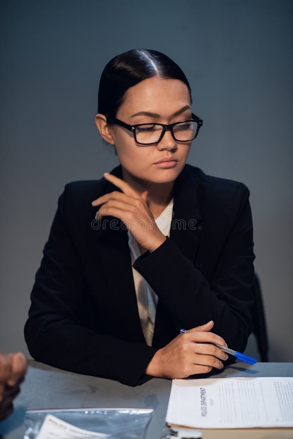 The State Prosecutor in a Black Business Suit and Glasses Sits at a ...