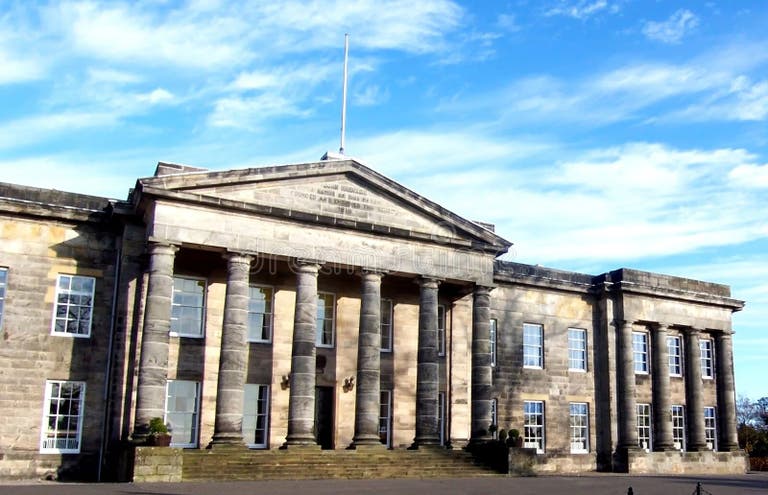 A Stately, Light-colored Stone Building Featuring a Prominent ...