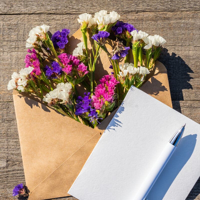 Static Flowers and an Envelope with an Empty Postcard. Stock Image ...