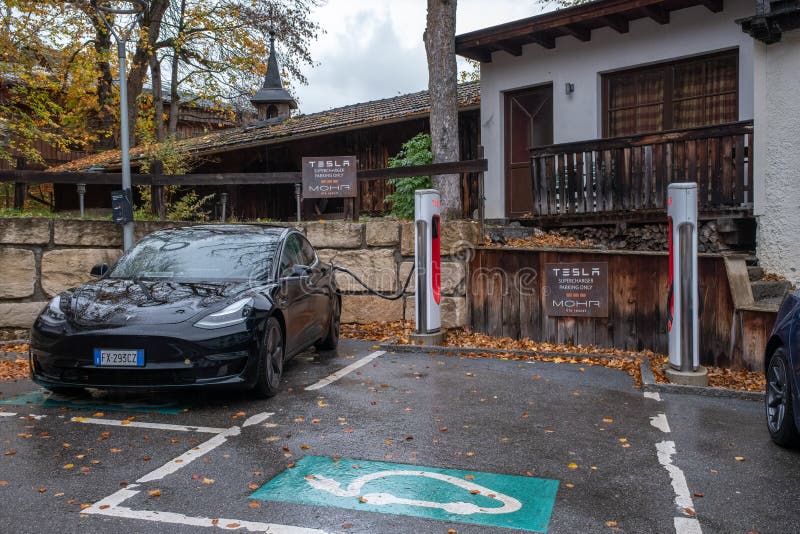 A Static Shot of a Solid Black Tesla Model 3 Dual Motor Charging at the ...
