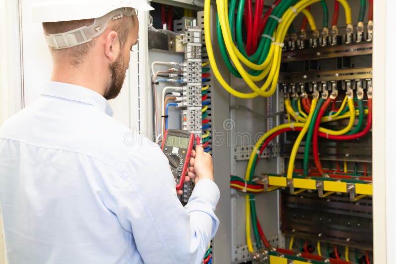 Maintenance Engineer Controls A Work Technological Process And Tests A ...