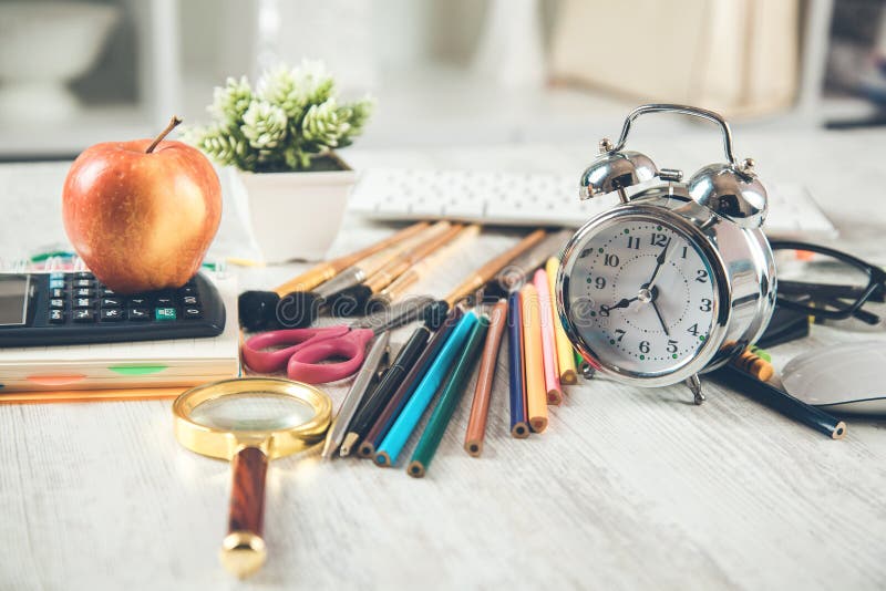 Stationary with Clock and Apple on Desk. Stock Photo - Image of apple ...