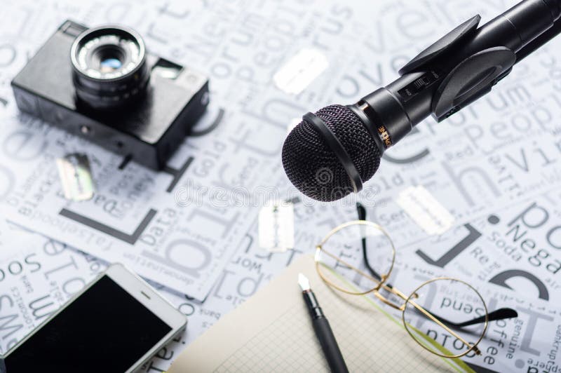 Stationery Items on the Table. Microphone, Voice Recorder and Notebook ...