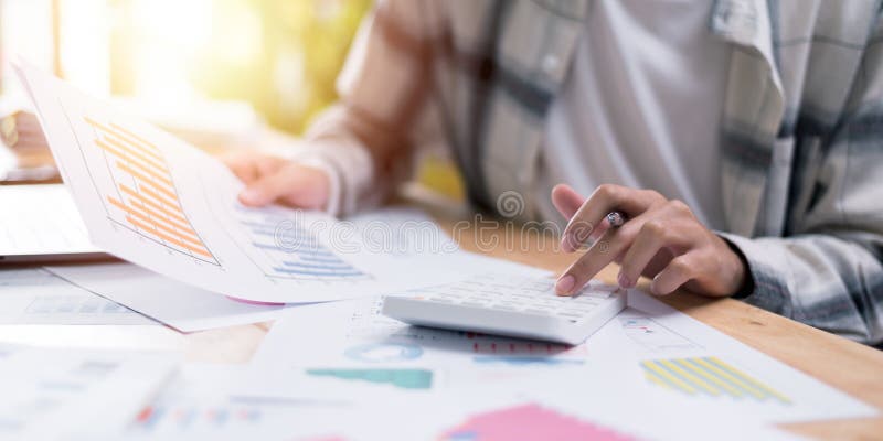 Statistical Analyst Reading Graph Report and Business Statistics Charts ...