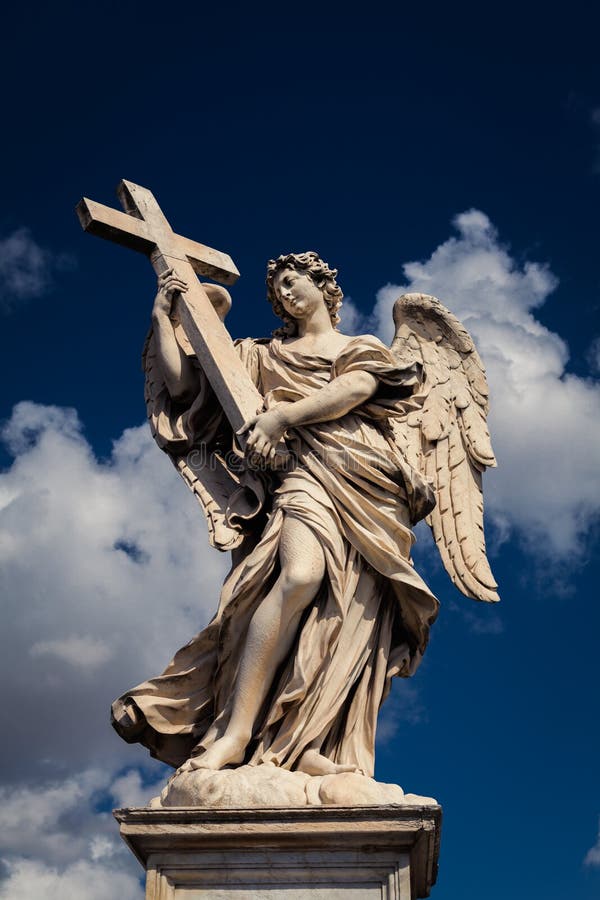 Statue of angel with cross stock image. Image of archangel - 59069405