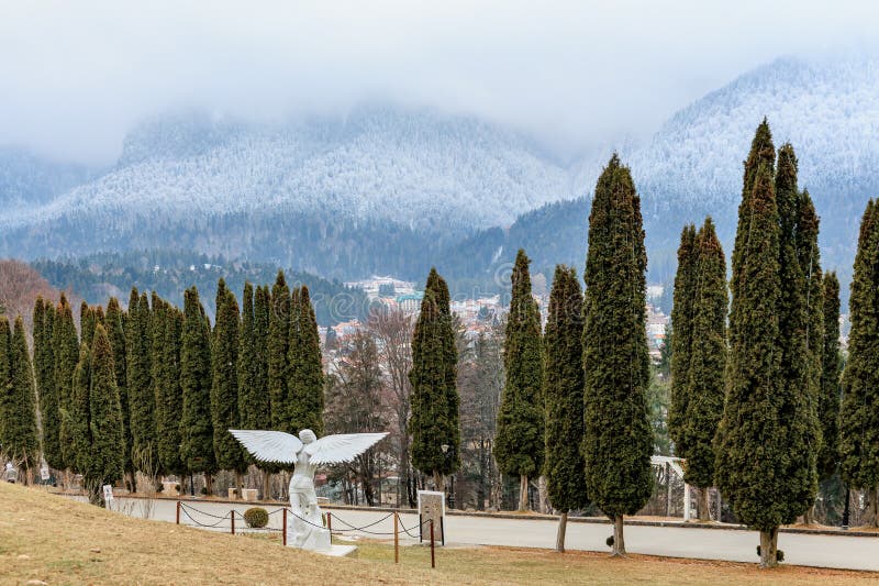 Statue of an Angel is in Front of a Row of Trees. December 15, 2024 ...