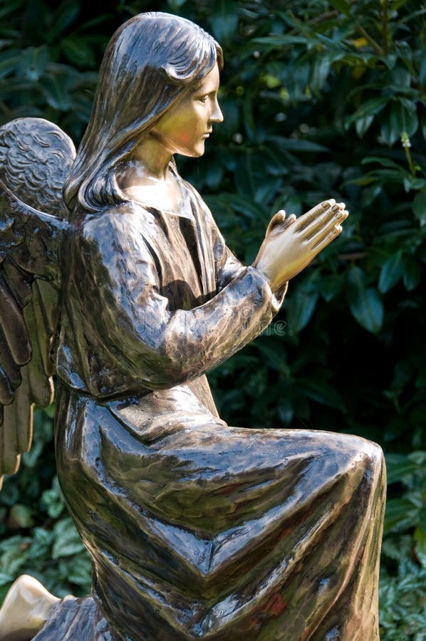Statue of angel at prayer stock photo. Image of winged - 6896644