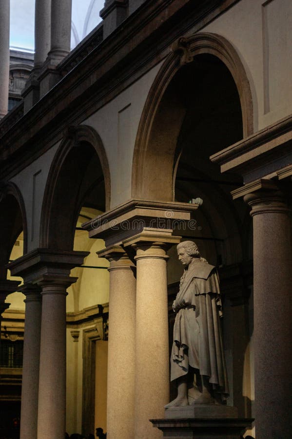 Statue in Architectural Corridor with Columns and Arches Stock Photo ...
