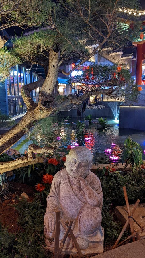 Statue of Bald Man Tree Red Flower Wood Lotus Stock Image - Image of ...