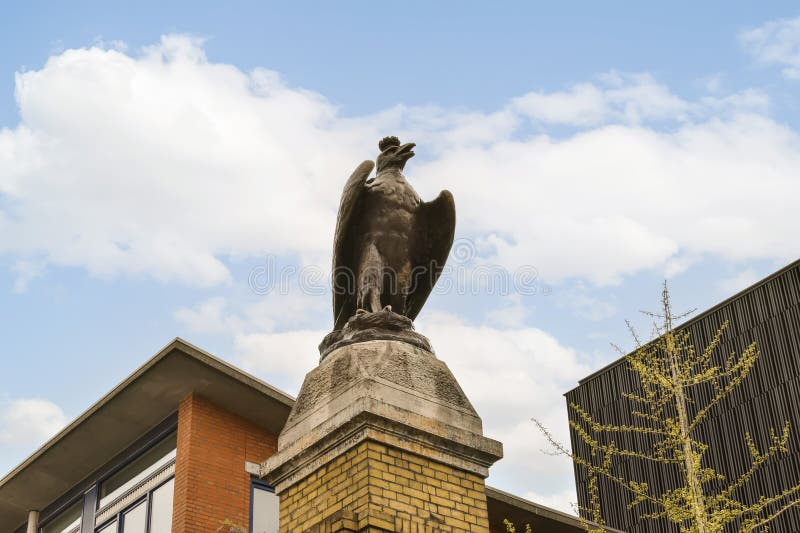 A Statue of a Bird on Top of a Building Stock Image - Image of monument ...