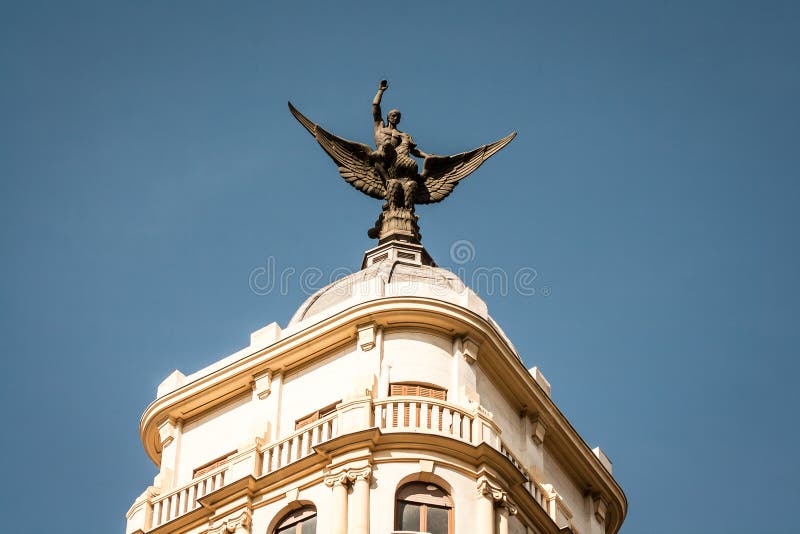 Statue On Building In Madrid Stock Image - Image of winged, rides: 36121067