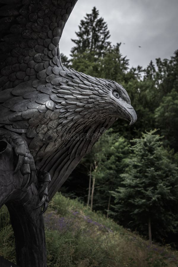 Statue of Eagle in Park Surrounded by Dense Trees Stock Photo - Image ...