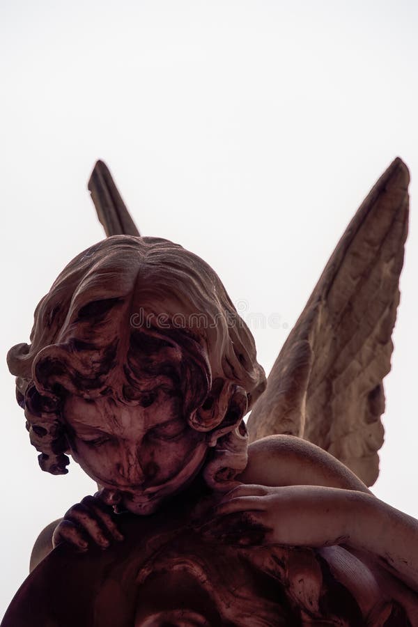 Statue of an Angel with Wings Against a White Background Stock Image ...