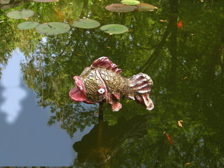 Statue of the Fish in the Pond Stock Photo - Image of lake, back: 99899202