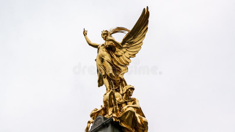 Statue of Gold Angel Reaching Toward the Sky Stock Image - Image of ...
