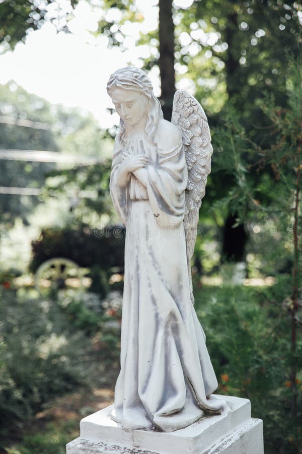 Statue of Guardian Angel in a Green Forest Stock Photo - Image of angel ...