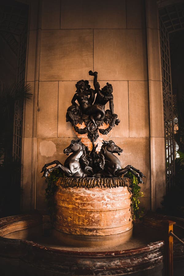 Statue of a Human Figure Elegantly in Front of a Brick Wall, Providing ...