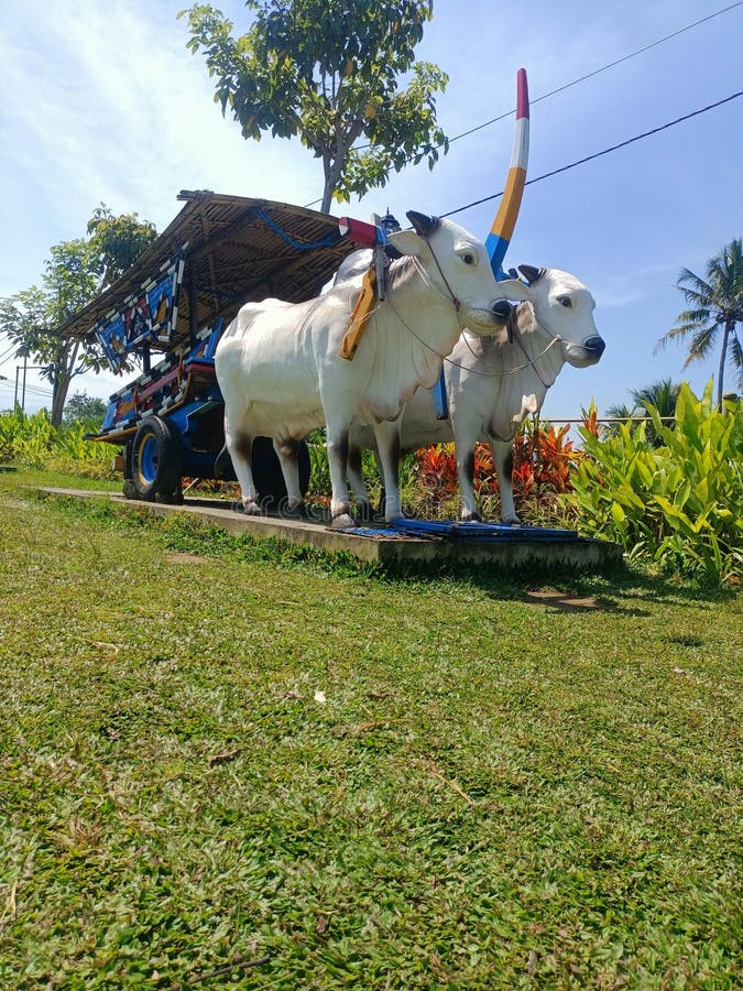 A Statue I.e. Two More Cows Carrying a Cart Behind Them Stock Photo ...