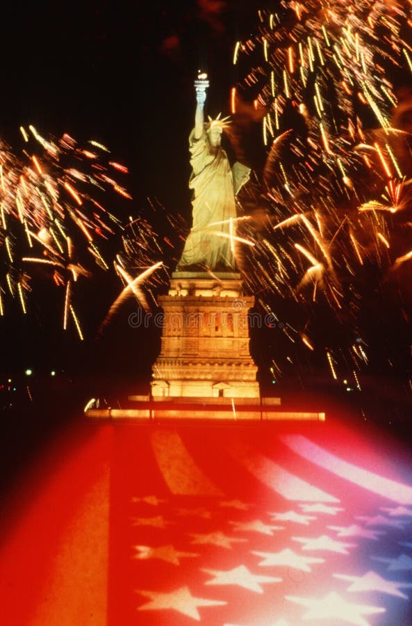 Statue of Liberty with Fireworks and U.S. Flag Stock Photo - Image of ...