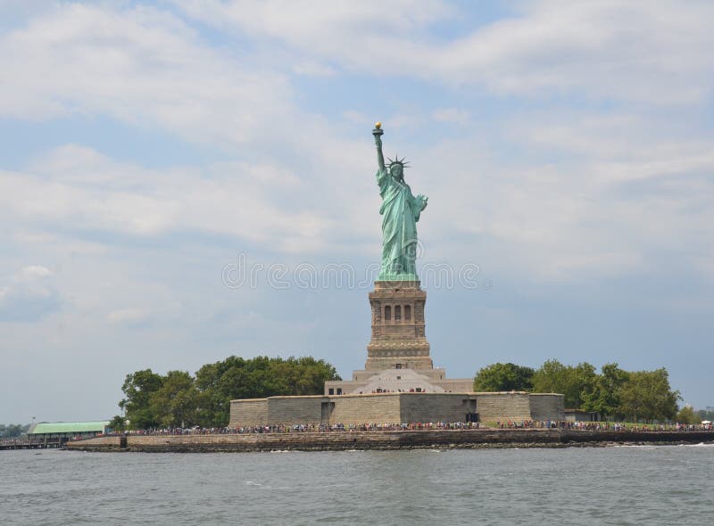 Statue of Liberty on an Island from the Water Stock Photo - Image of ...