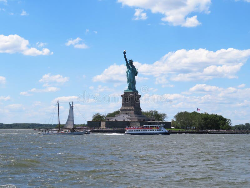 The Statue of Liberty in New York City with a Blue Sky Background Stock ...