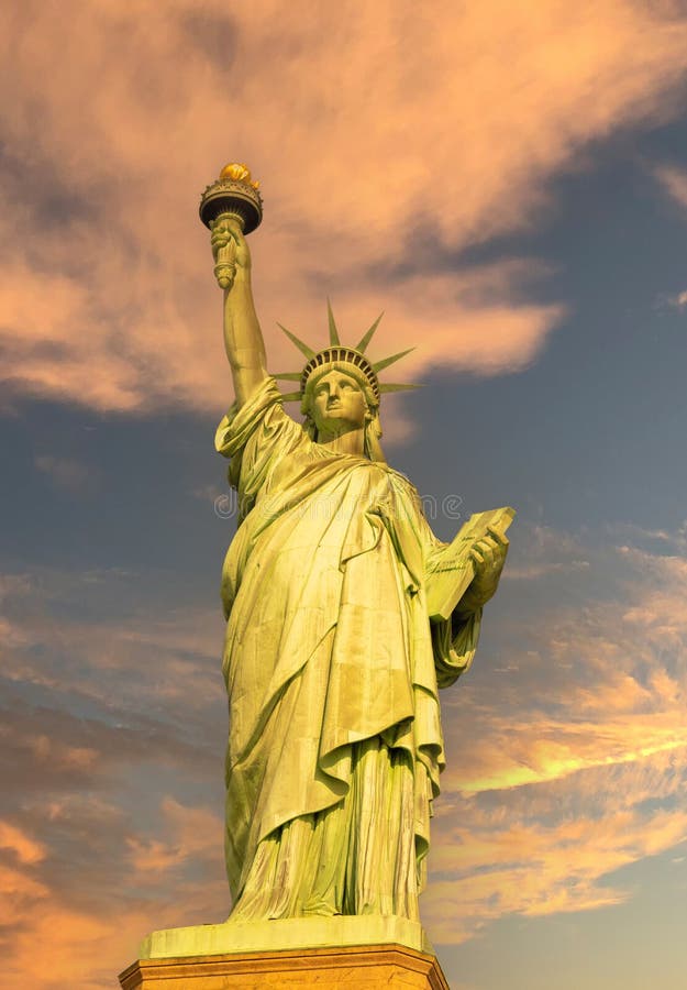 Statue of Liberty at Sunrise in Golden Tones Front View Stock Photo ...