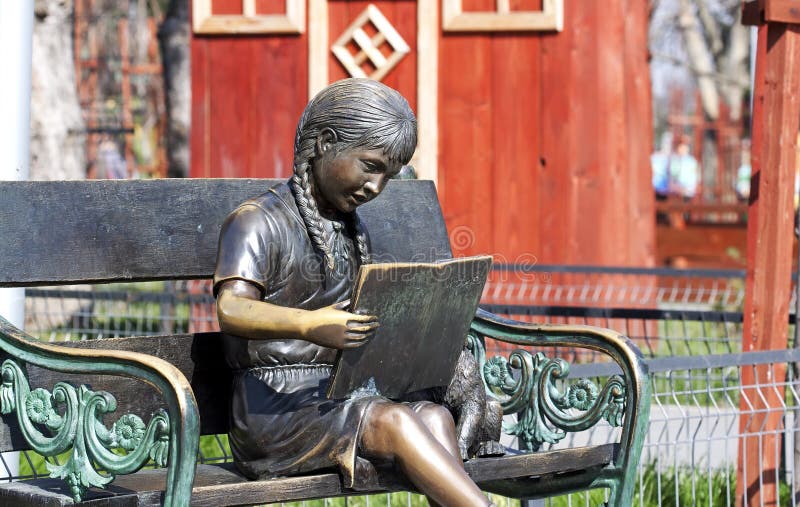Little Girl Reading Book Statue Stock Photos - Free & Royalty-Free ...