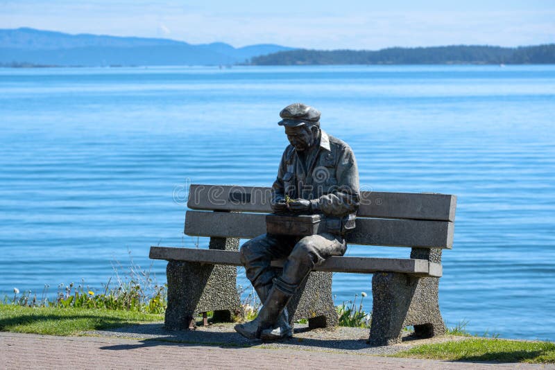 Statue of a Man on a Bench by the Ocean at the Sidney Waterfront ...