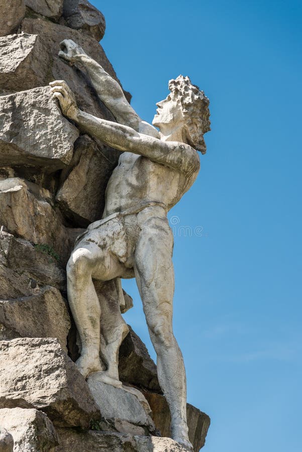 Statue of a Man Climbing a Rock Stock Photo - Image of adventure ...