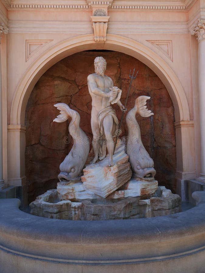 A Statue of a Man with Fish by His Sides Stock Image - Image of column ...