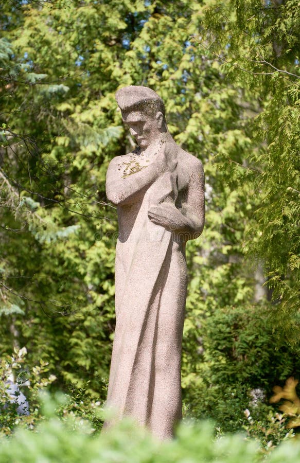 Statue of a Man at Rainis Cemetery Editorial Photography - Image of ...