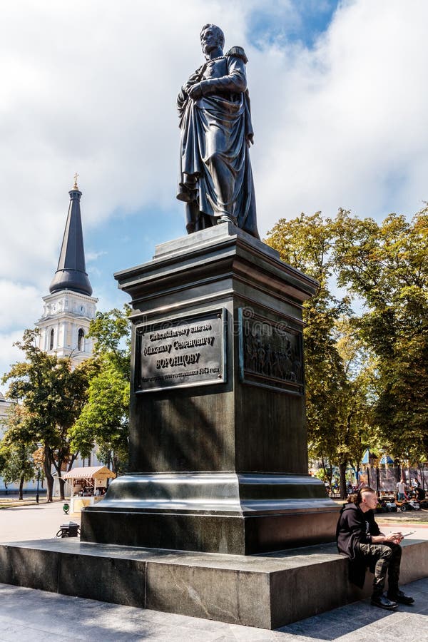 A Statue of a Man Sits in Front of a Building Editorial Image - Image ...
