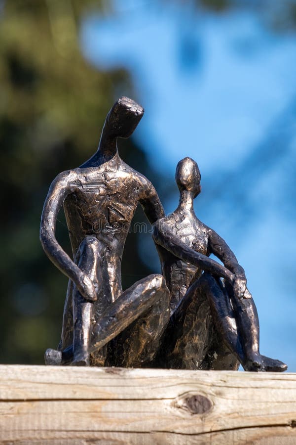 Statue of a Man and a Woman Sitting Together Stock Image - Image of ...