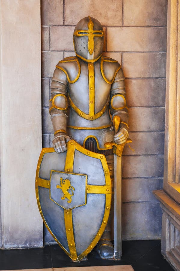 Statue of a Medieval European Knight in Armor with a Sword and Shield ...