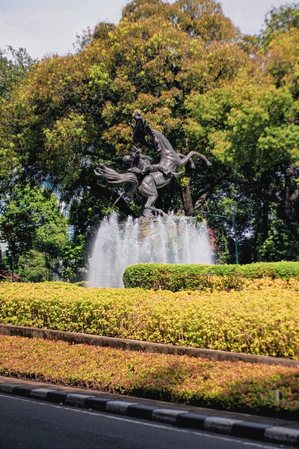 Statue at Menteng, Jakarta. Editorial Image - Image of tree, green ...