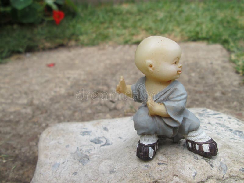 Small Monk Statue. stock photo. Image of meditating - 101038908