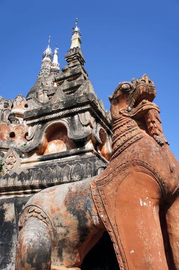 Statue of a Mythical Animal on the Background of the Temple in Myanmar ...