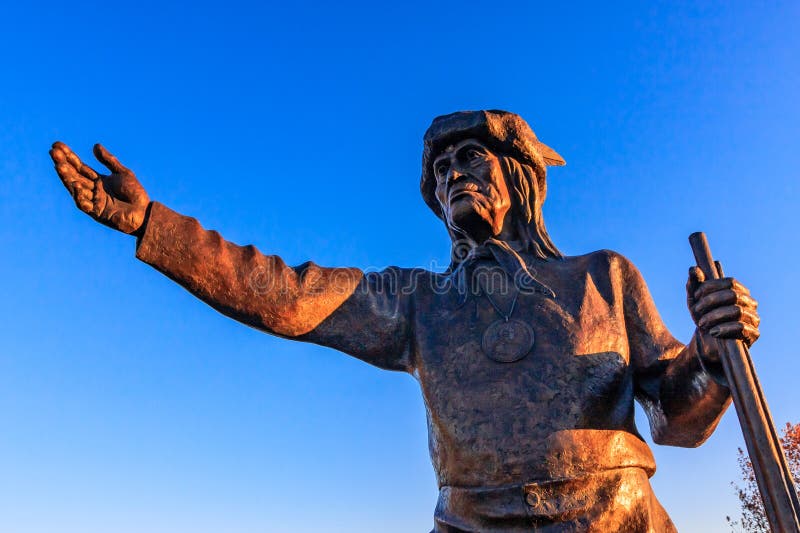 A Statue of a Native American Man Holding a Staff Editorial Stock Photo ...
