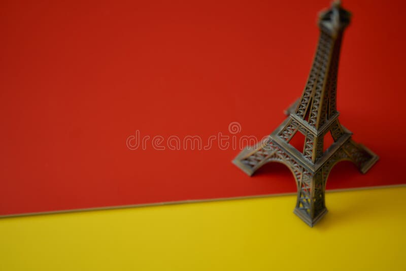 Statue of the Paris Tower on Red and Yellow Backgrounds Stock Image ...