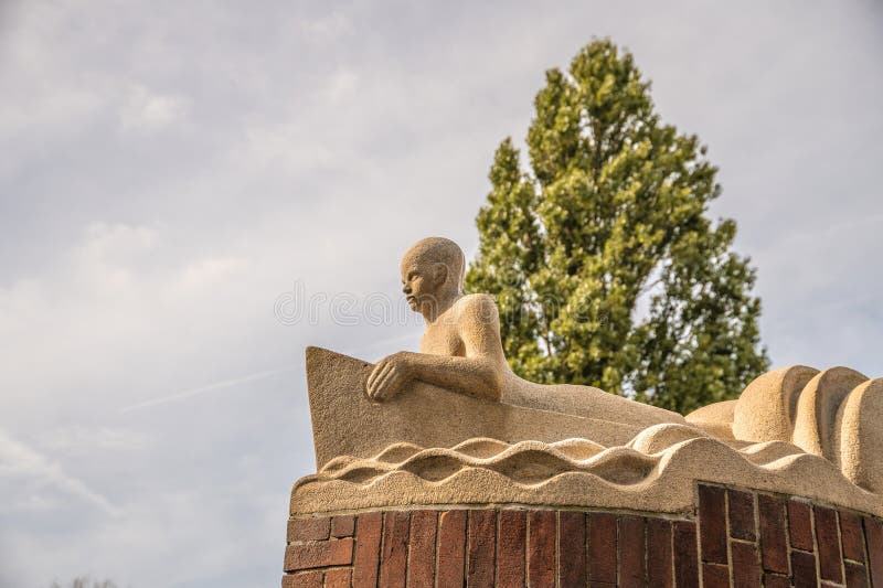A Statue of a Person Sitting on Top of a Editorial Photography - Image ...