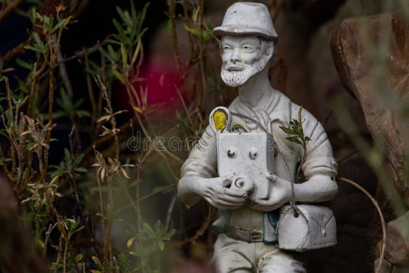Statue of a Photographer in Our Garden Stock Image - Image of person ...