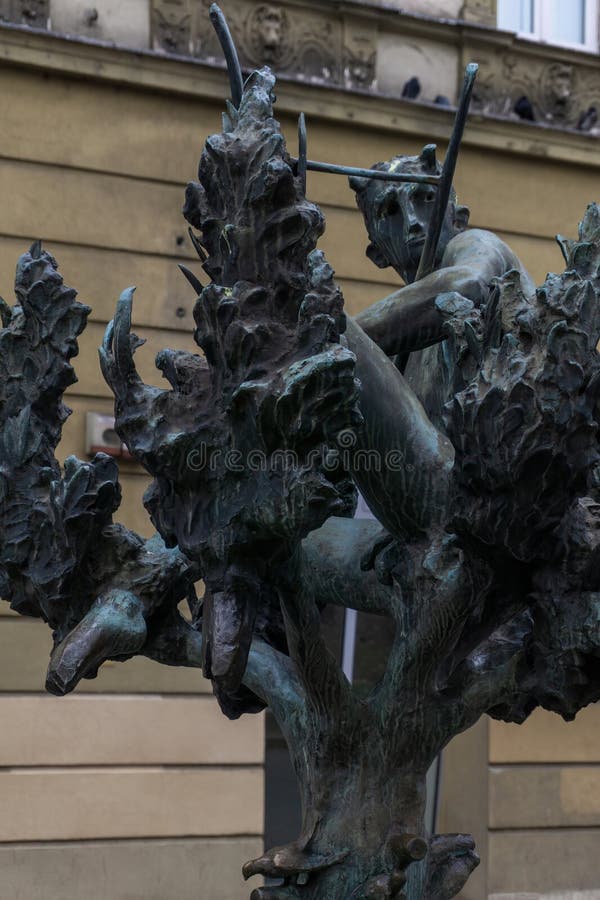 Statue of a Satyr with a Small Harp on a Tree Editorial Photography ...