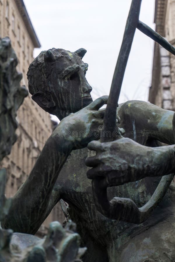 Statue of a Satyr with a Small Harp on a Tree Stock Photo - Image of ...