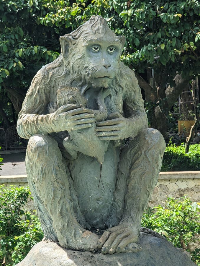 Statue of a Sitting Monkey on a Rock in a Garden Stock Image - Image of ...