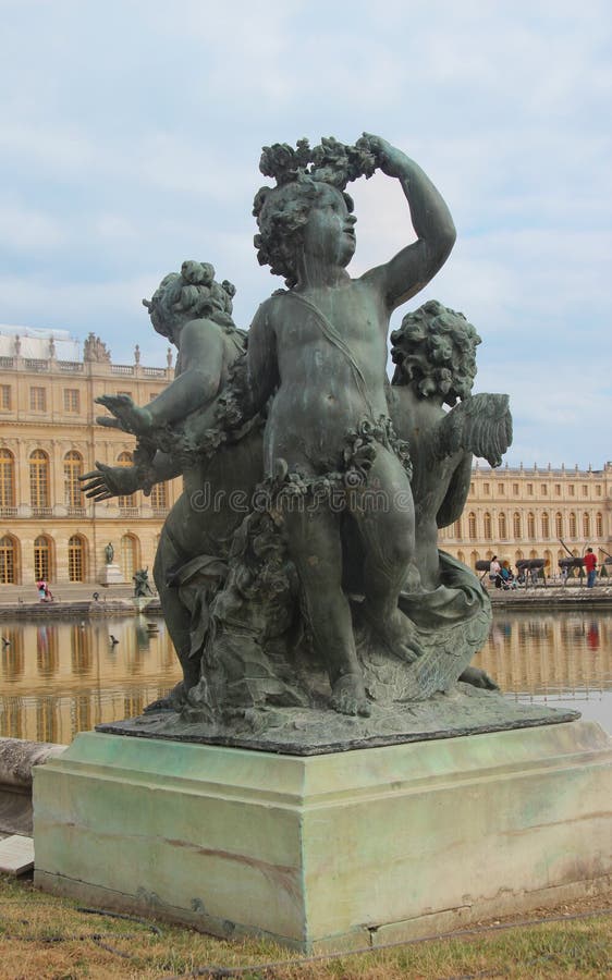 Statue of Three Girls at Versailles Stock Image - Image of blue, garden ...