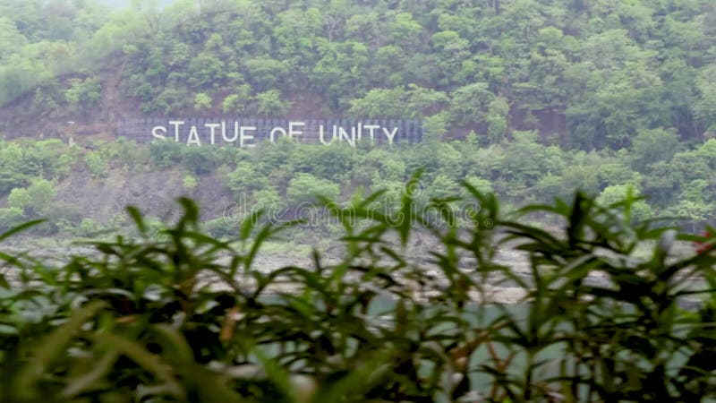 Statue of Unity Board Written at Green Mountain with River at Morning ...