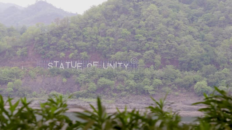 Statue of Unity Board Written at Green Mountain with River at Morning ...
