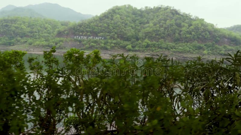 Statue of Unity Board Written at Green Mountain with River at Morning ...
