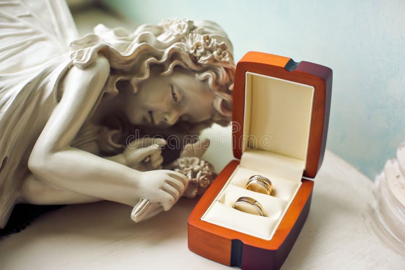 Statue and wedding rings stock image. Image of casual - 75583247