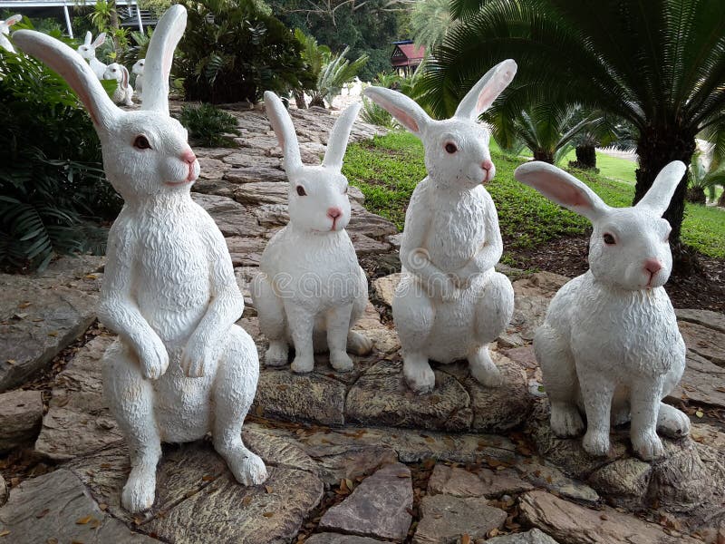 Statue of White Rabbits in the Garden Stock Photo - Image of rock ...